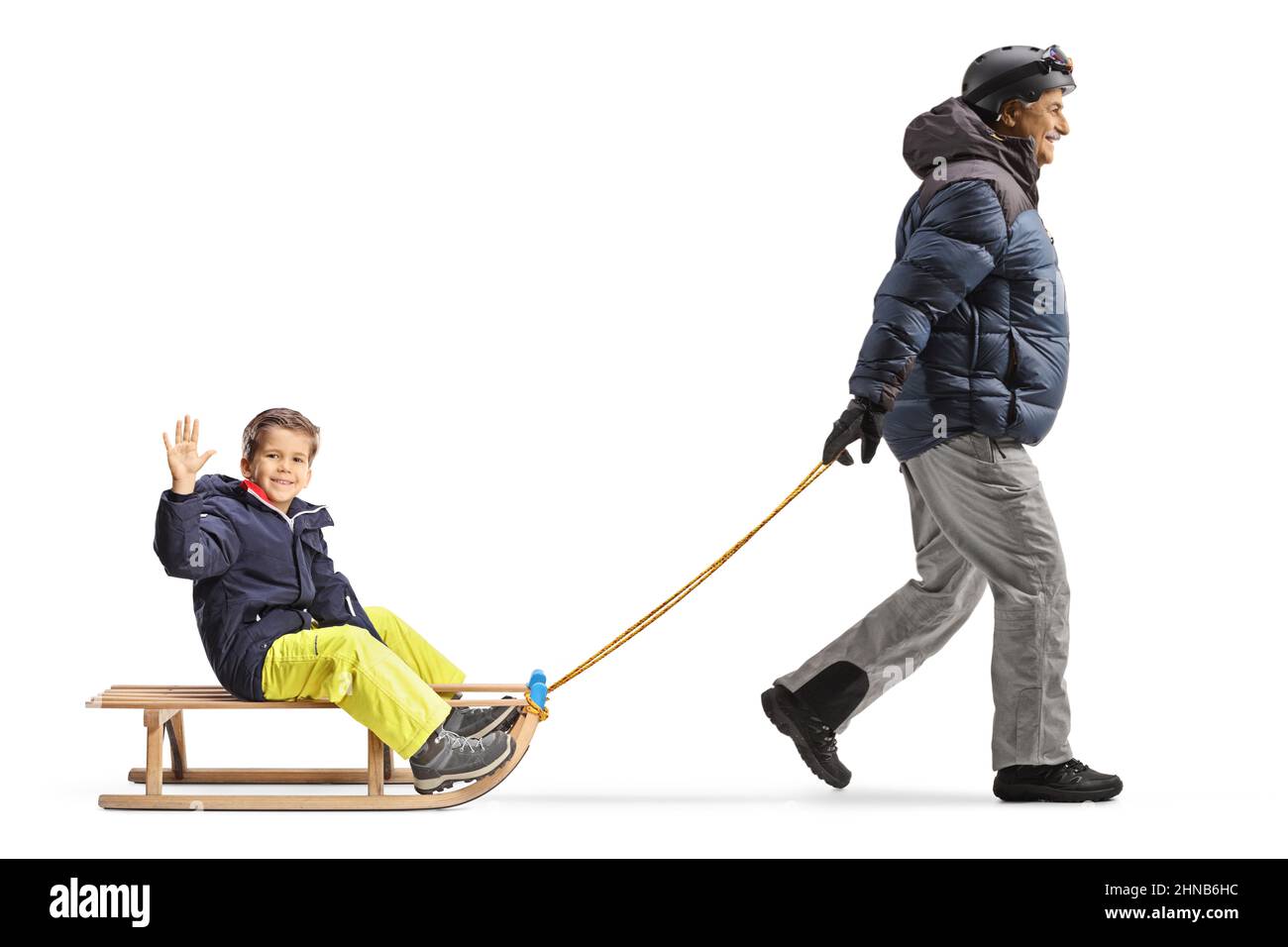 Boy pulling sledge Cut Out Stock Images & Pictures - Alamy