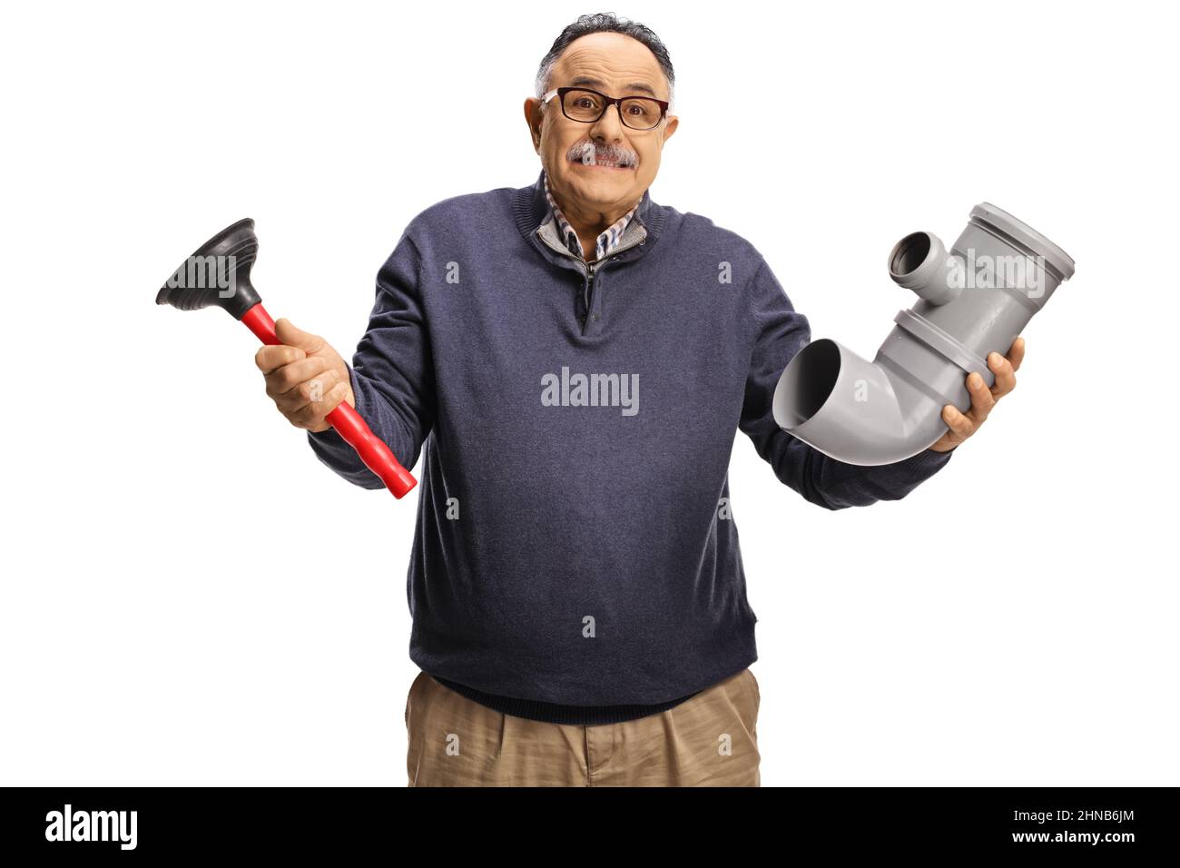 Confused mature man holding a pipe and a toilet plunger isolated on ...