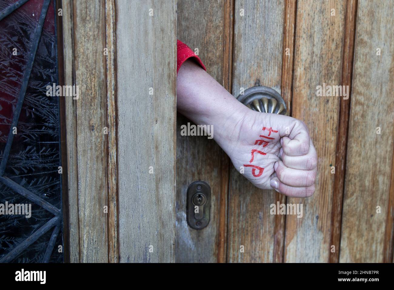 domestic violence, asking for help, a woman's hand makes a sign asking ...