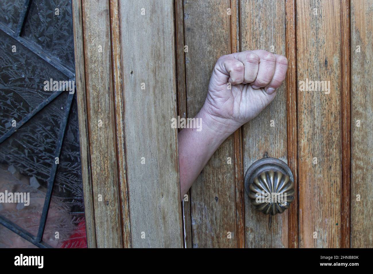 domestic violence, asking for help, a woman's hand makes a sign asking ...