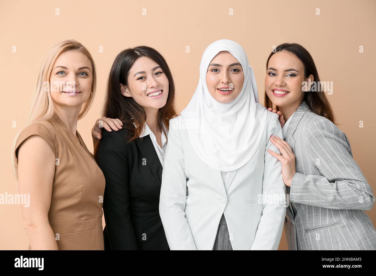 Beautiful women on color background. Unity concept Stock Photo - Alamy