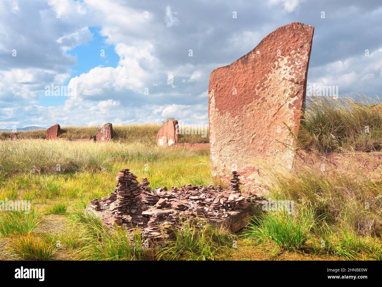 The burial mound of the 5th century BC, steles of red stone under a ...