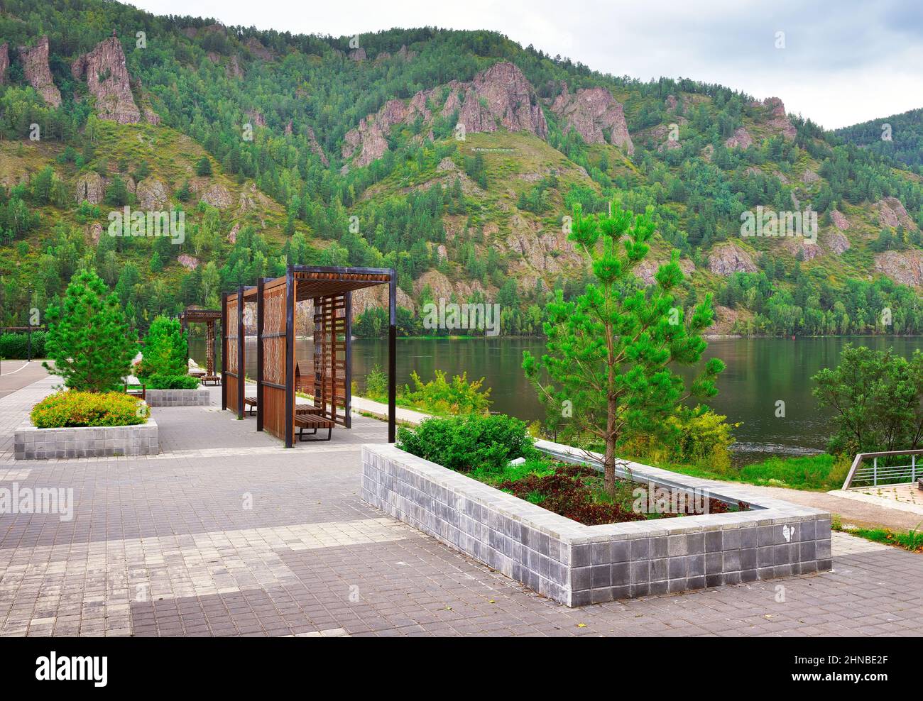 New landscaping of the city embankment on the background of a rocky ...