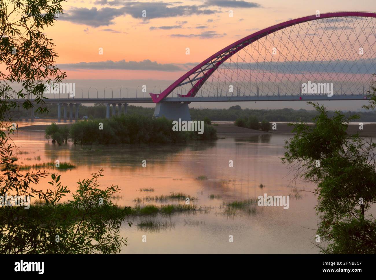 High arched cable stayed road bridge across the wide river hi-res stock ...