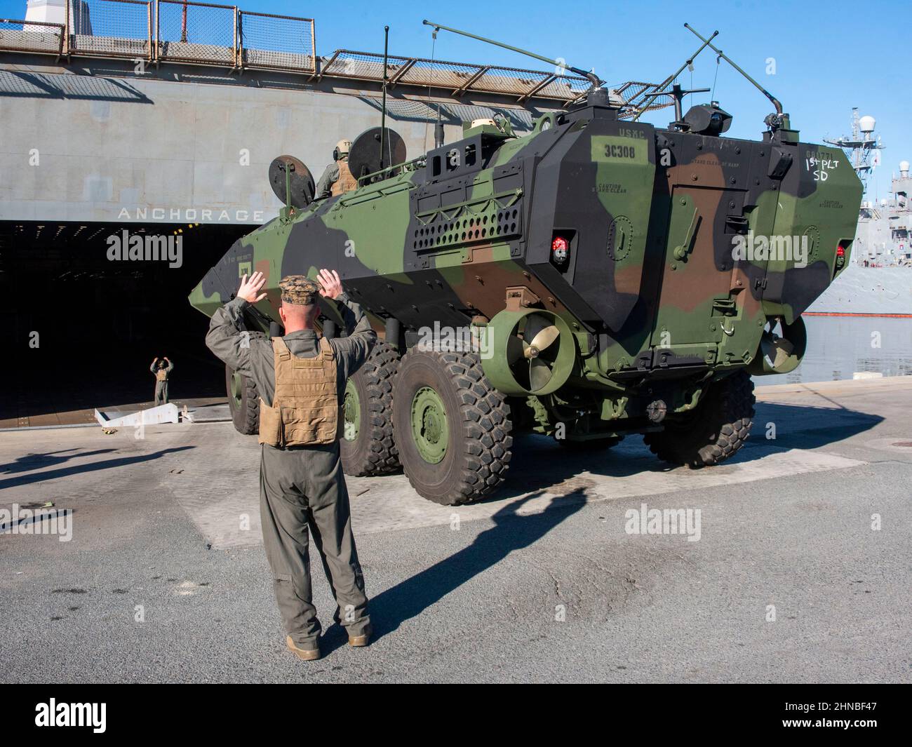 U.S. Marines and Navy Sailors load an Amphibious Combat Vehicle (ACV ...