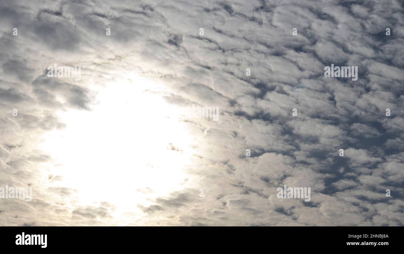 Clouds dim the sun rays Stock Photo - Alamy