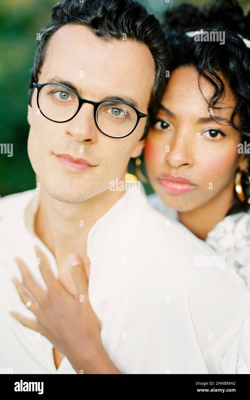 Woman hugs a man from behind. Portrait Stock Photo - Alamy