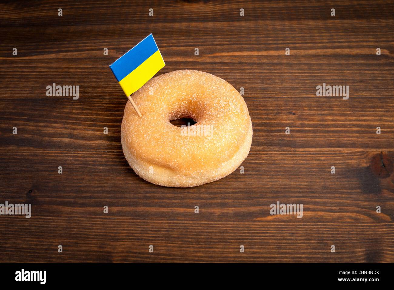 Ukrainian flag is inserted in the donut. Politics and crisis situation ...