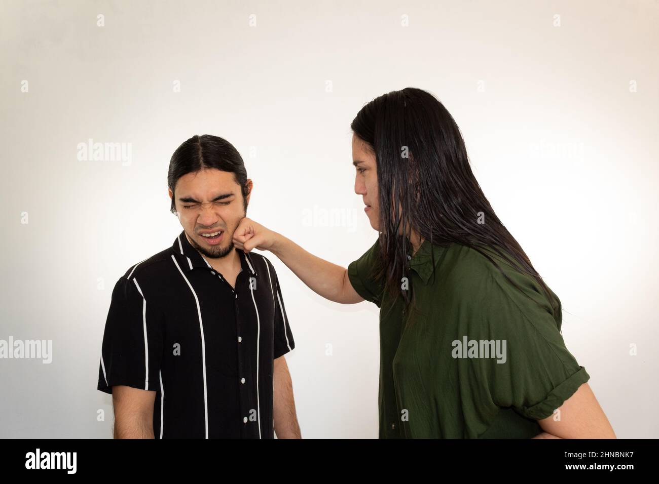 married couple fighting on a white background Stock Photo - Alamy