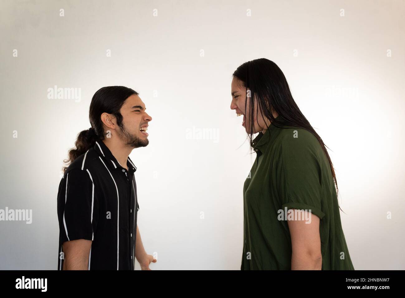 married couple fighting and screaming on a white background Stock Photo ...