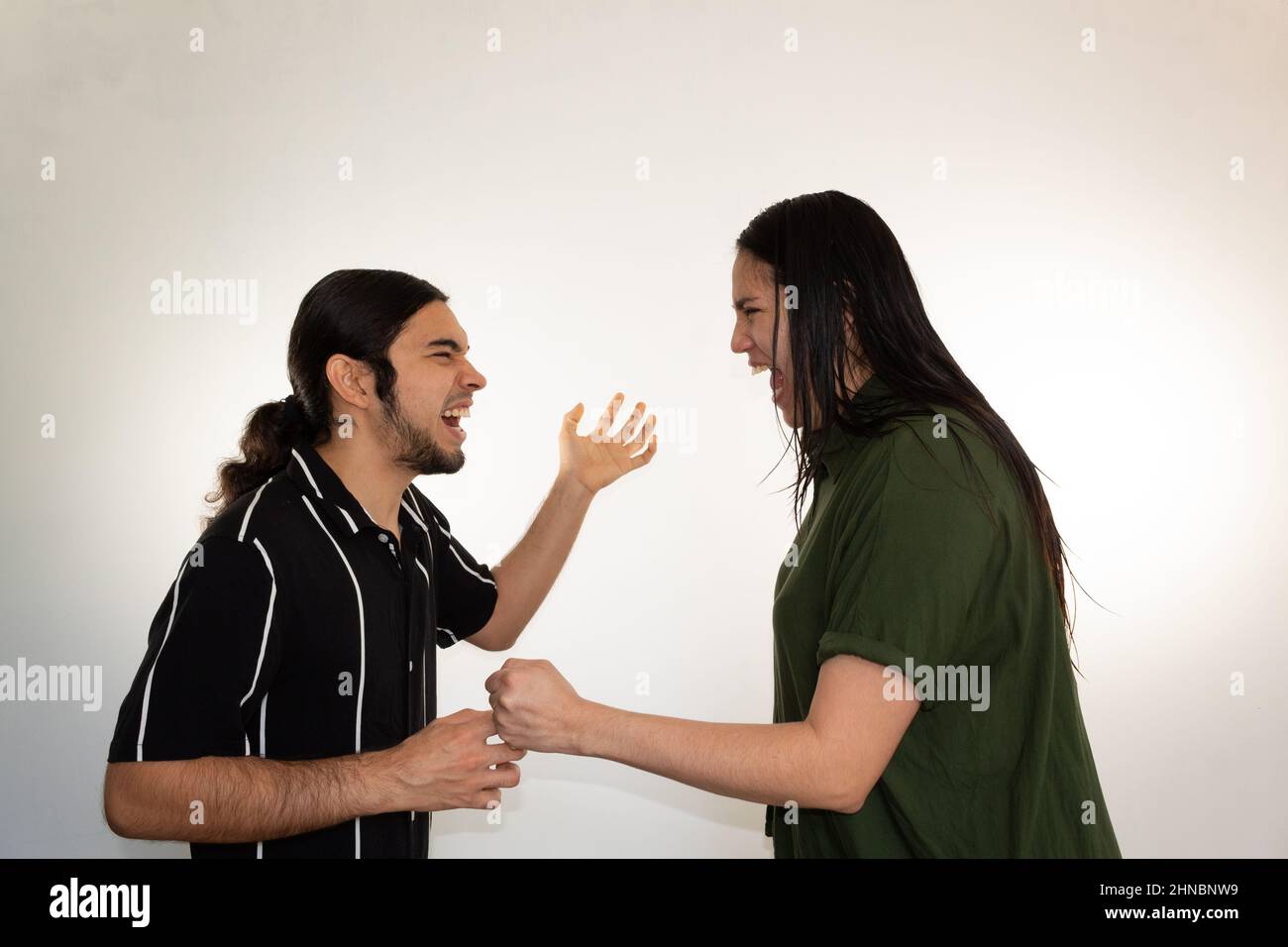 married couple fighting and screaming on a white background Stock Photo ...