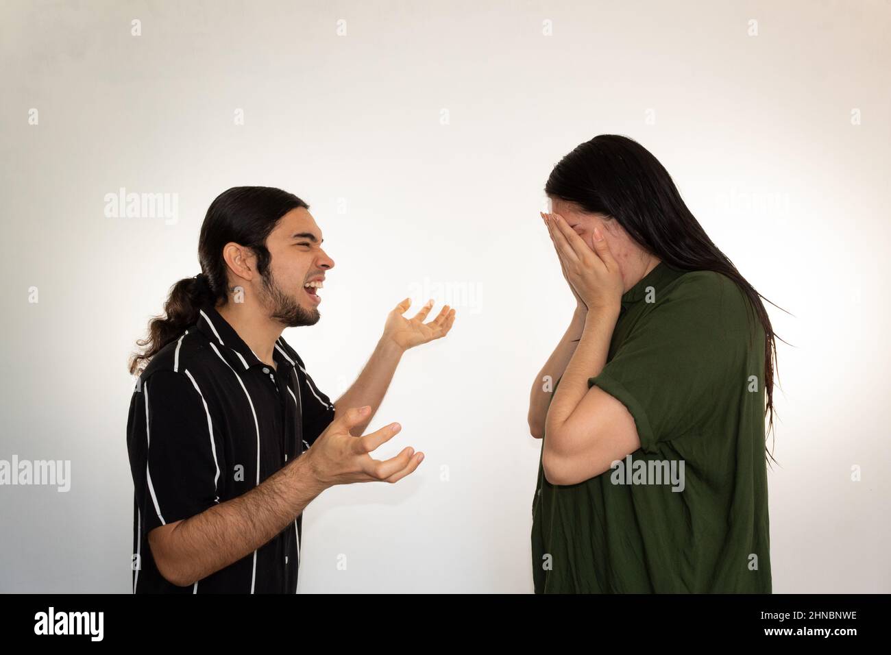 married couple fighting and screaming on a white background Stock Photo ...