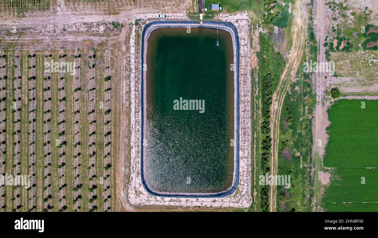 Aerial view of a water tank for irrigation in agriculture Stock Photo ...