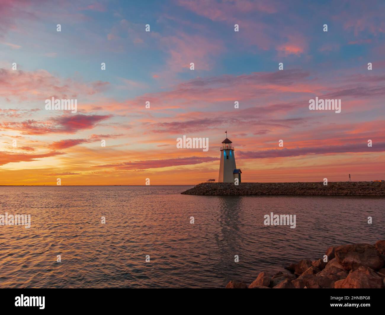 Sunset beautiful afterglow over the lighthouse of Lake Hefner at ...