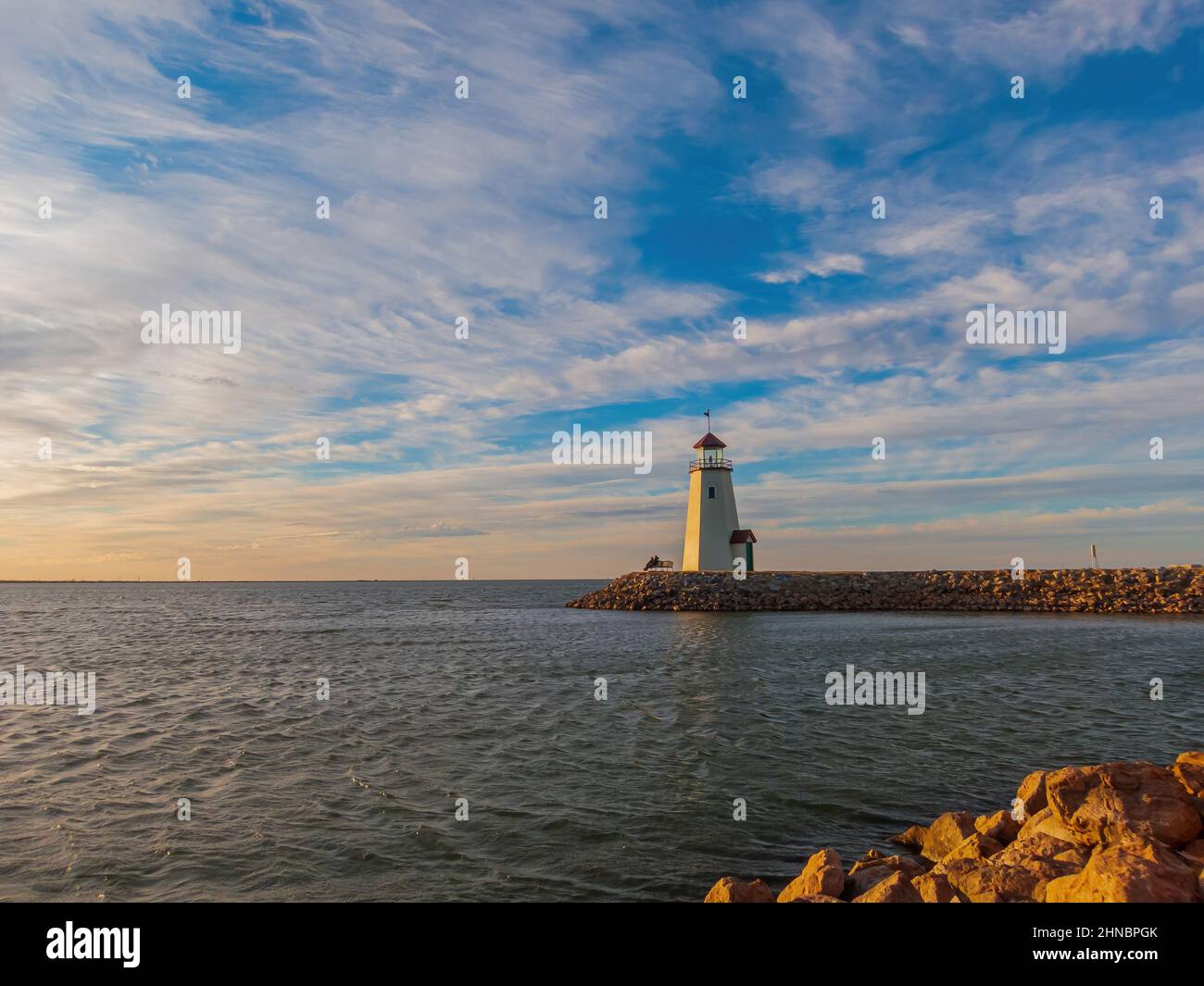 Sunset beautiful afterglow over the lighthouse of Lake Hefner at ...