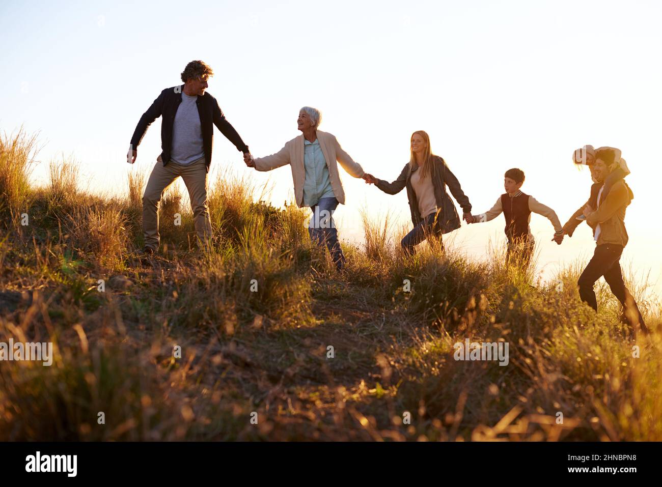 Working together to reach greater heights. Shot of a happy family ...