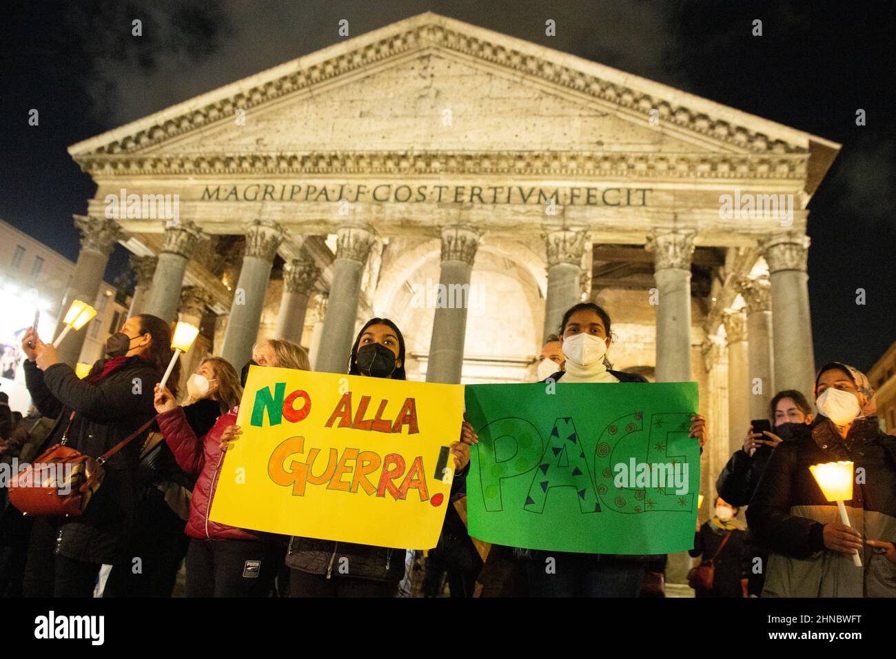 Rome, Italy. 15th Feb, 2022. Flashmob "#nowar" with a torchlight procession in front of the ...