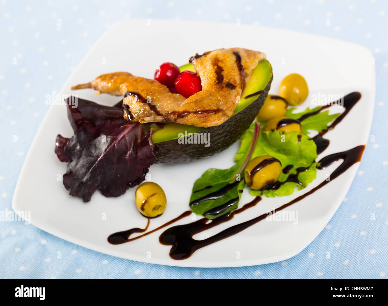 Tasty fried legs of quail served with vegetables and balsamic pasta ...