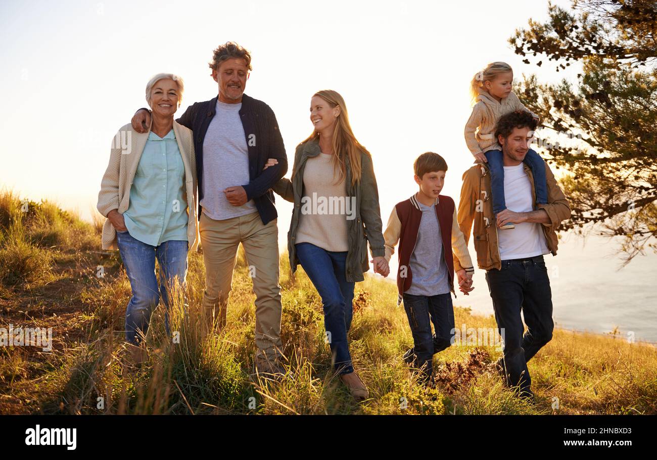 Three generations of happiness. Shot of a happy family out on a morning ...