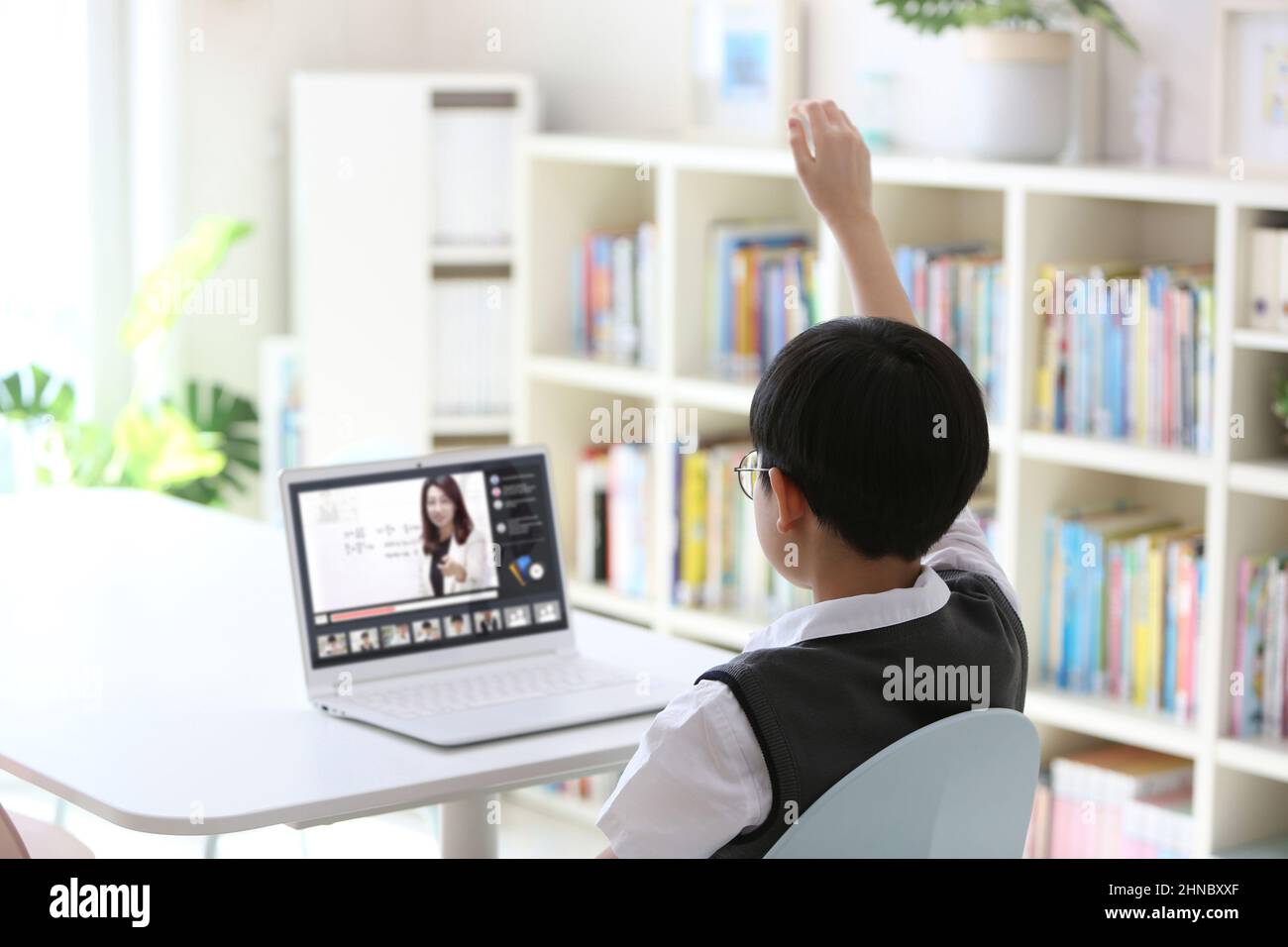 Boy raising hand computer class hi-res stock photography and images - Alamy