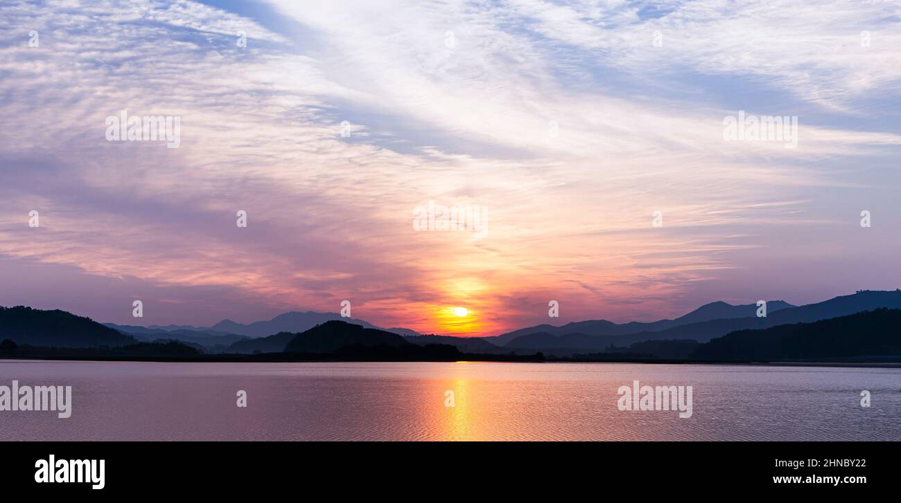 Beautiful sunrise and sunset scenery lake and mountains and red sky sun and clouds Stock Photo ...