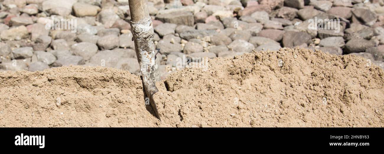 Panoramic banner of Shovel for scoop sand in construction work, sand ...