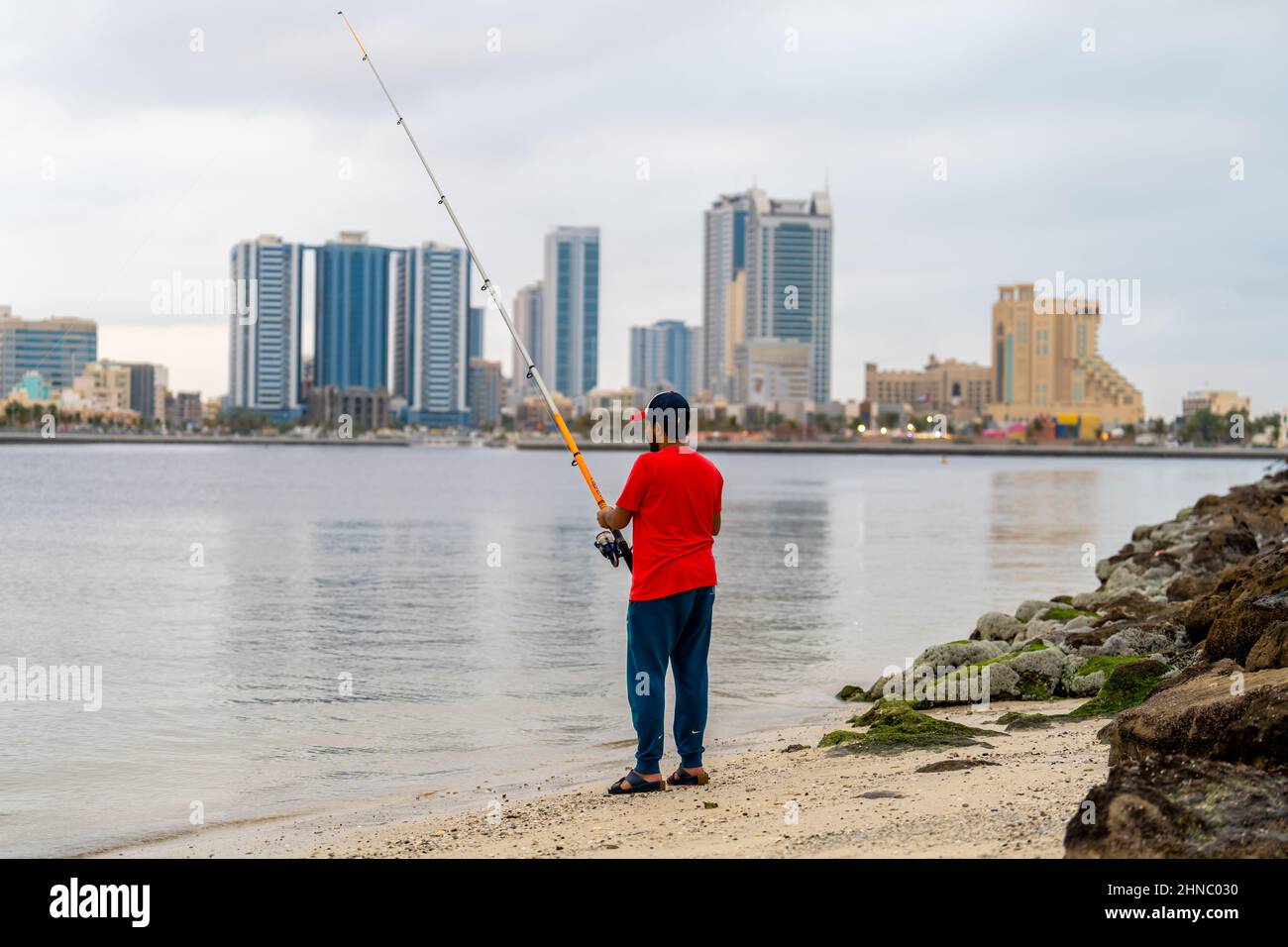 Fisherman on Al-Zawra Beach in Ajman Stock Photo - Alamy