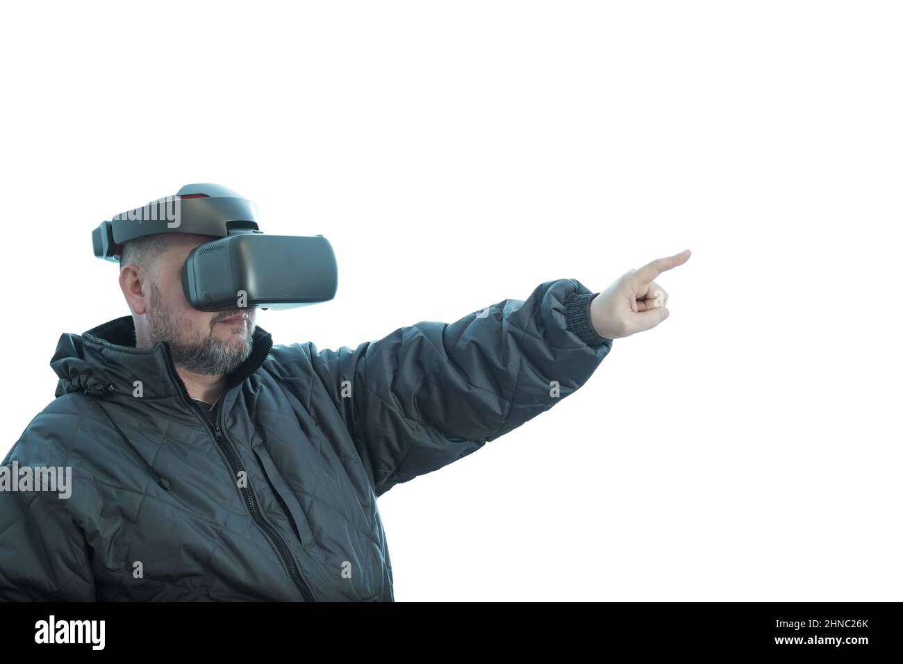 A man wearing vr glasses points his finger forward Stock Photo - Alamy