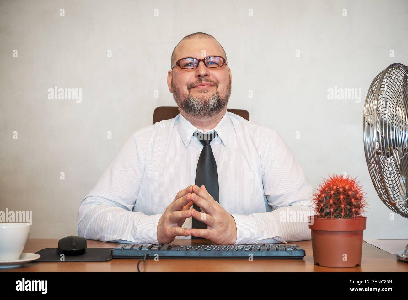 The man comically portrays the work of a businessman. He shows ...