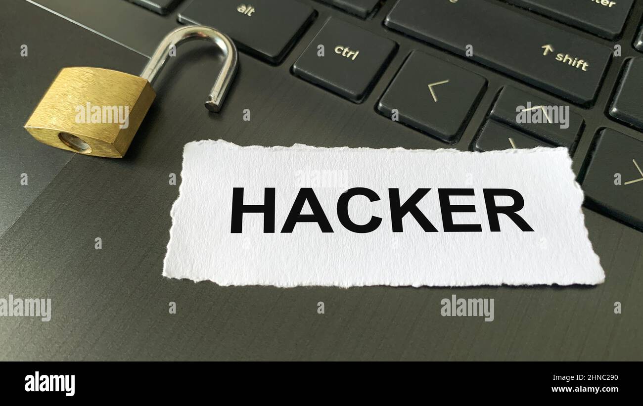 Close Up View Of Text On Torn Paper Hacker With Blurred Locker And