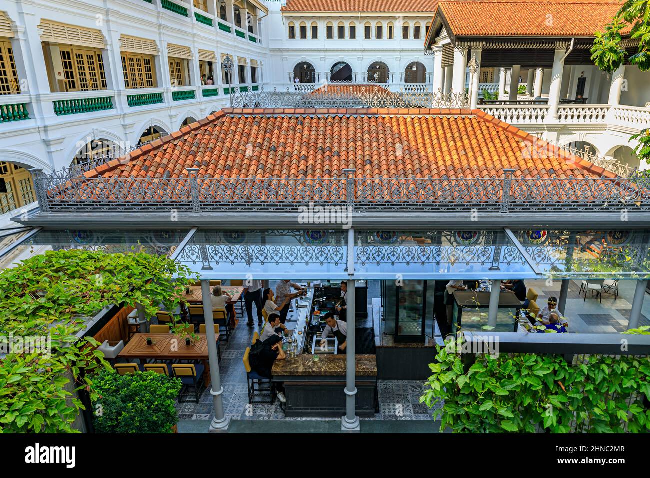 Singapore - September 08, 2019: The Raffles Courtyard bar at the iconic ...