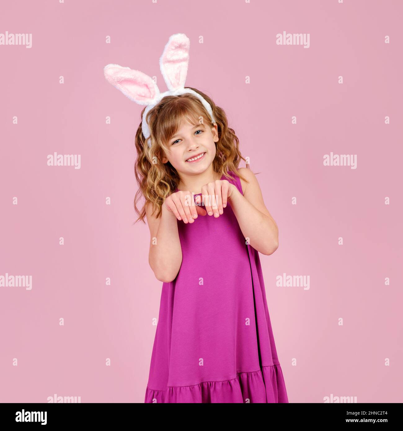 Cute little girl acting like rabbit during Easter celebration Stock ...