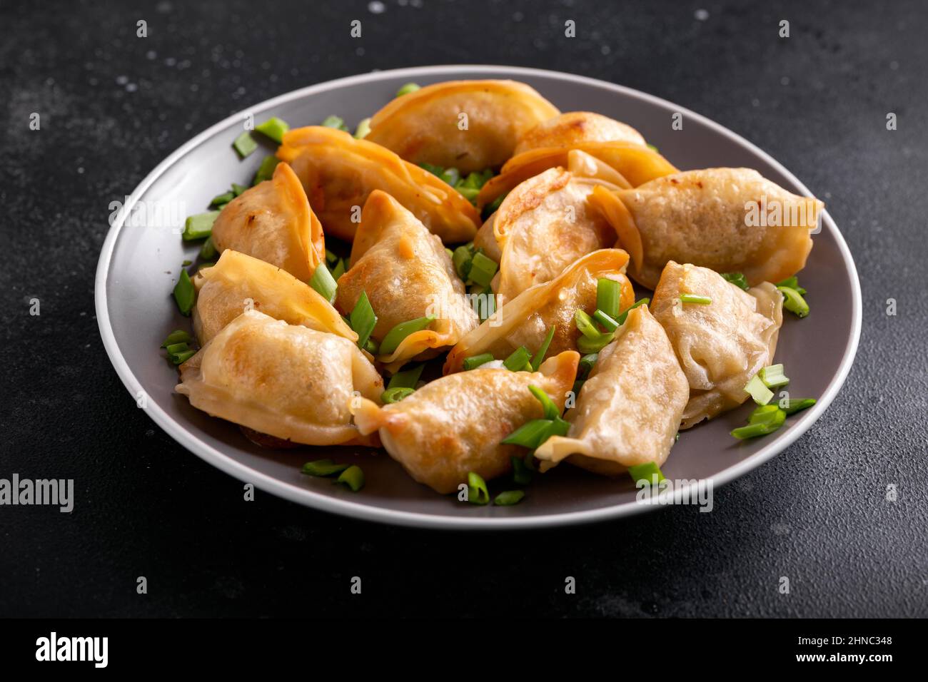 Deep fried crispy gyoza with spring onion. Asian food Stock Photo - Alamy