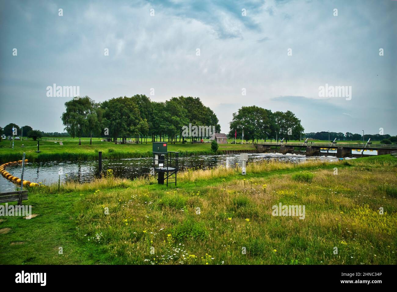 Drone view of the river Vecht, green grass, trees, beautiful blue sky ...