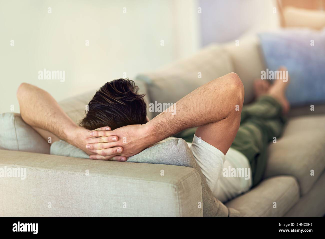 Man feet up sofa hi-res stock photography and images - Alamy