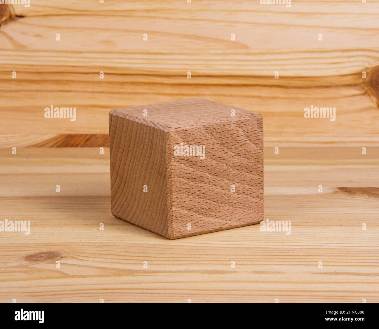 One wooden cube square on wood vintage background copyspace Stock Photo ...