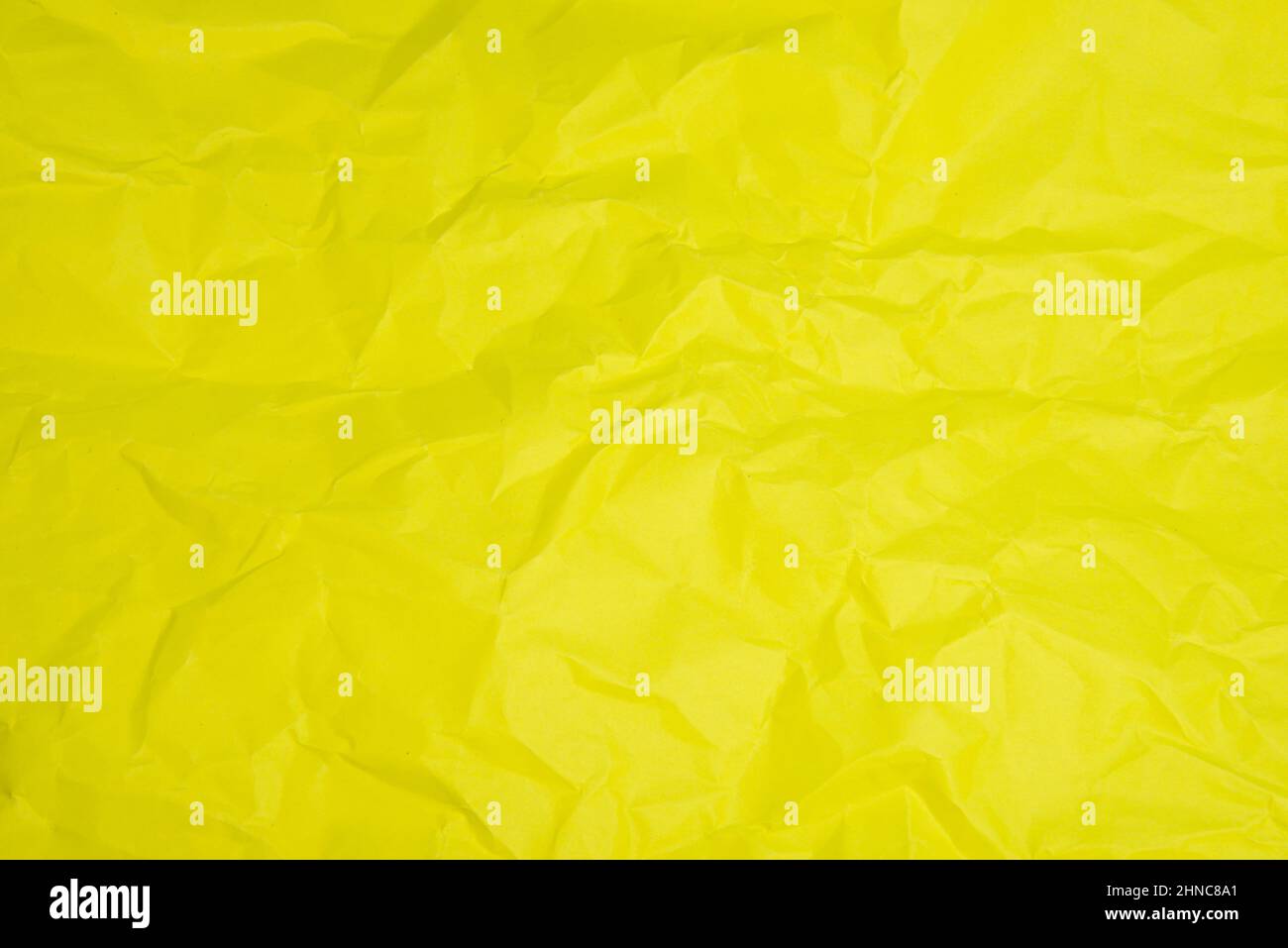 Crumpled empty bright yellow paper texture Stock Photo - Alamy