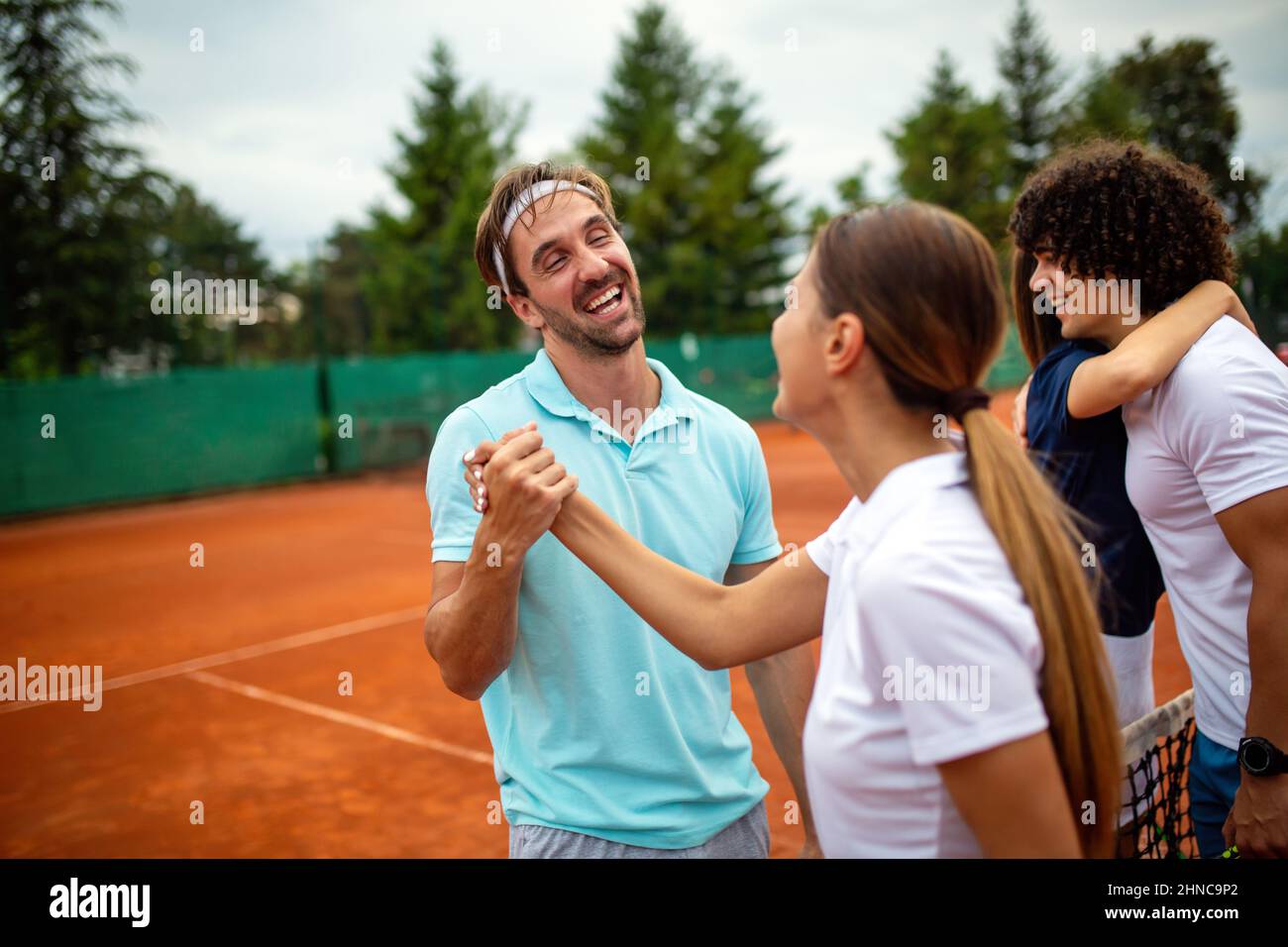 Group of tennis people players giving a handshake after a match Stock ...