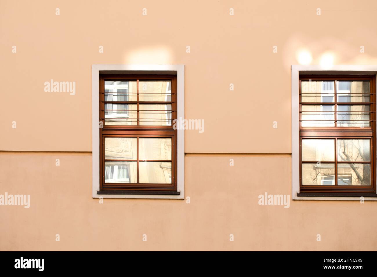 Glare and window reflections on the facade of an old tenement house ...