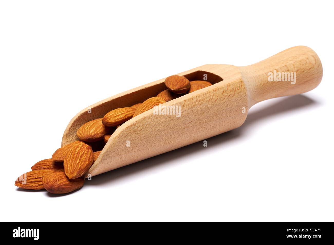 Wooden Scoop full of Almond nuts isolated on a white background Stock ...