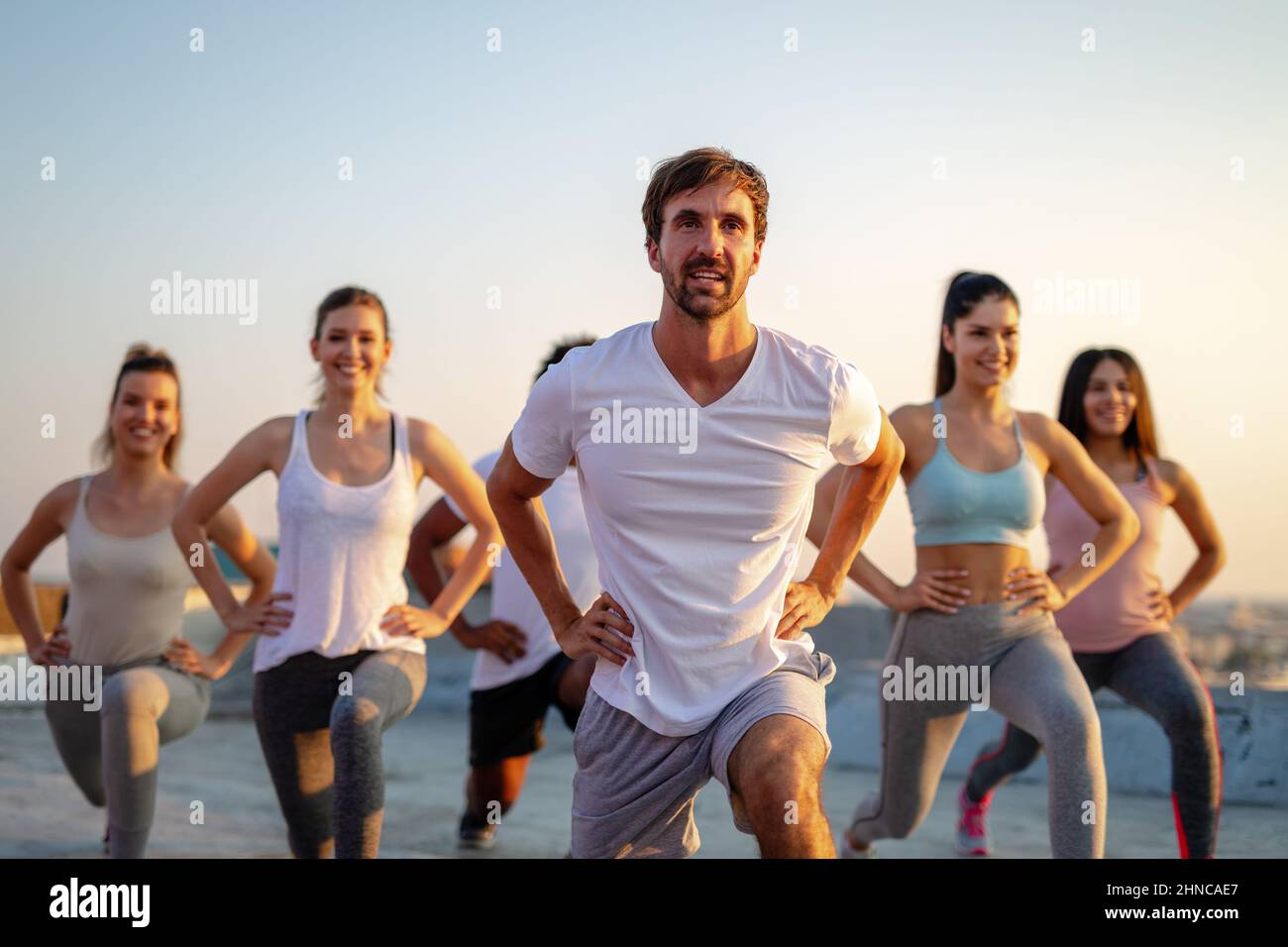 Group of fit people exercising together to stay healthy. Sport people ...