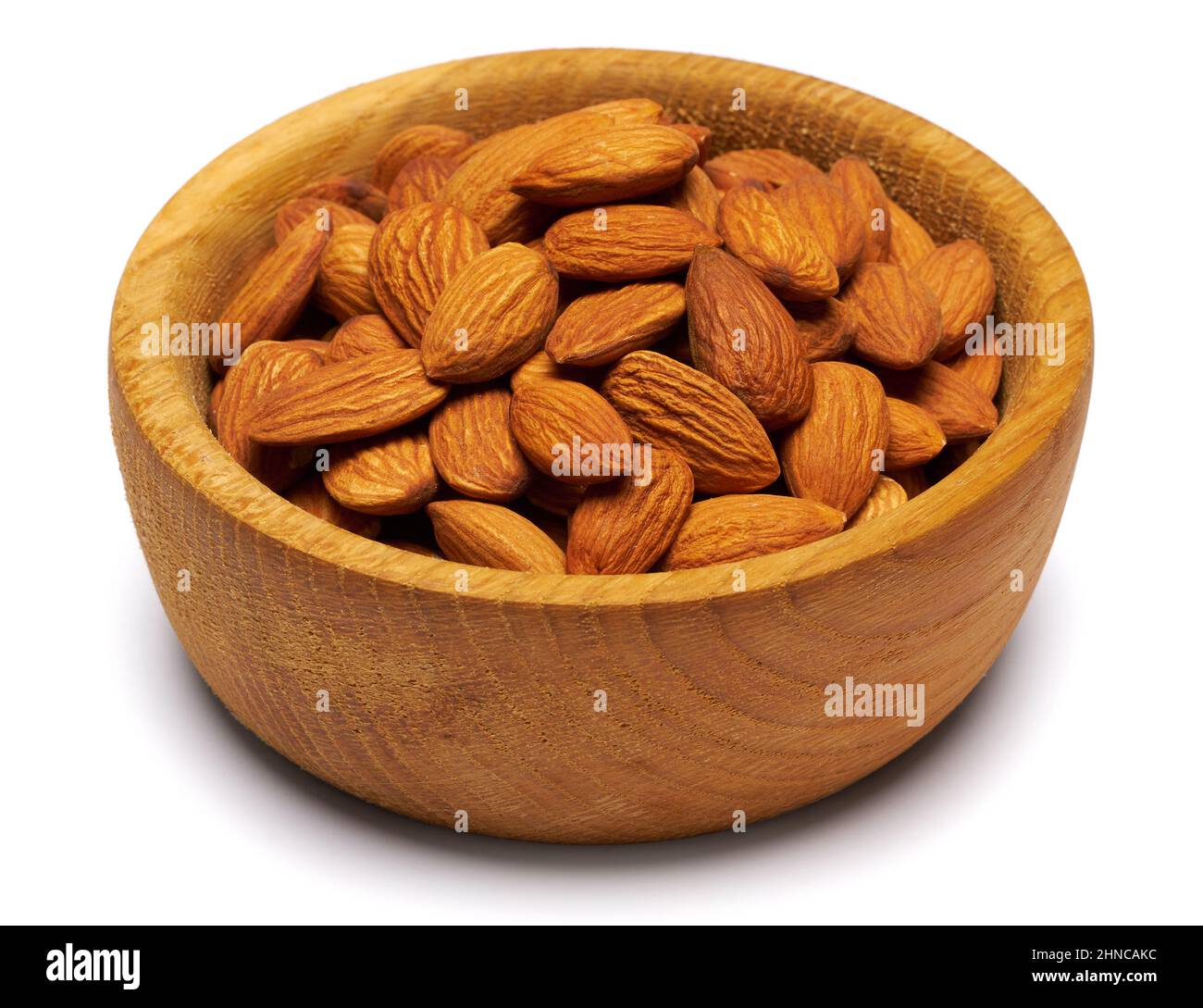 Wooden bowl full of Almond nuts isolated on a white background Stock ...
