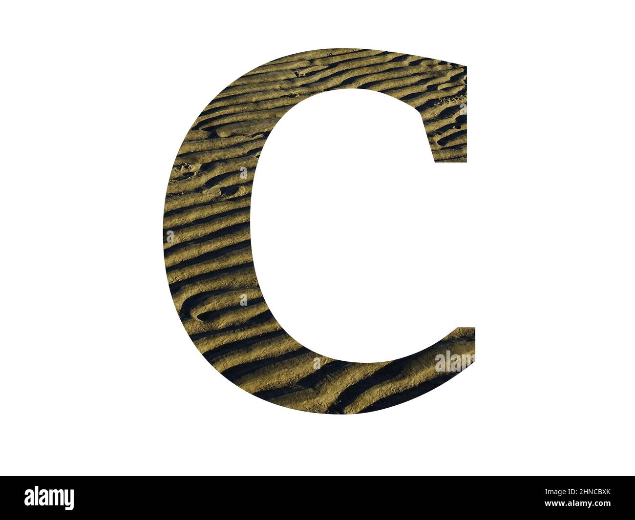 letter C of the alphabet made with ridges from the beach, color yellow ...