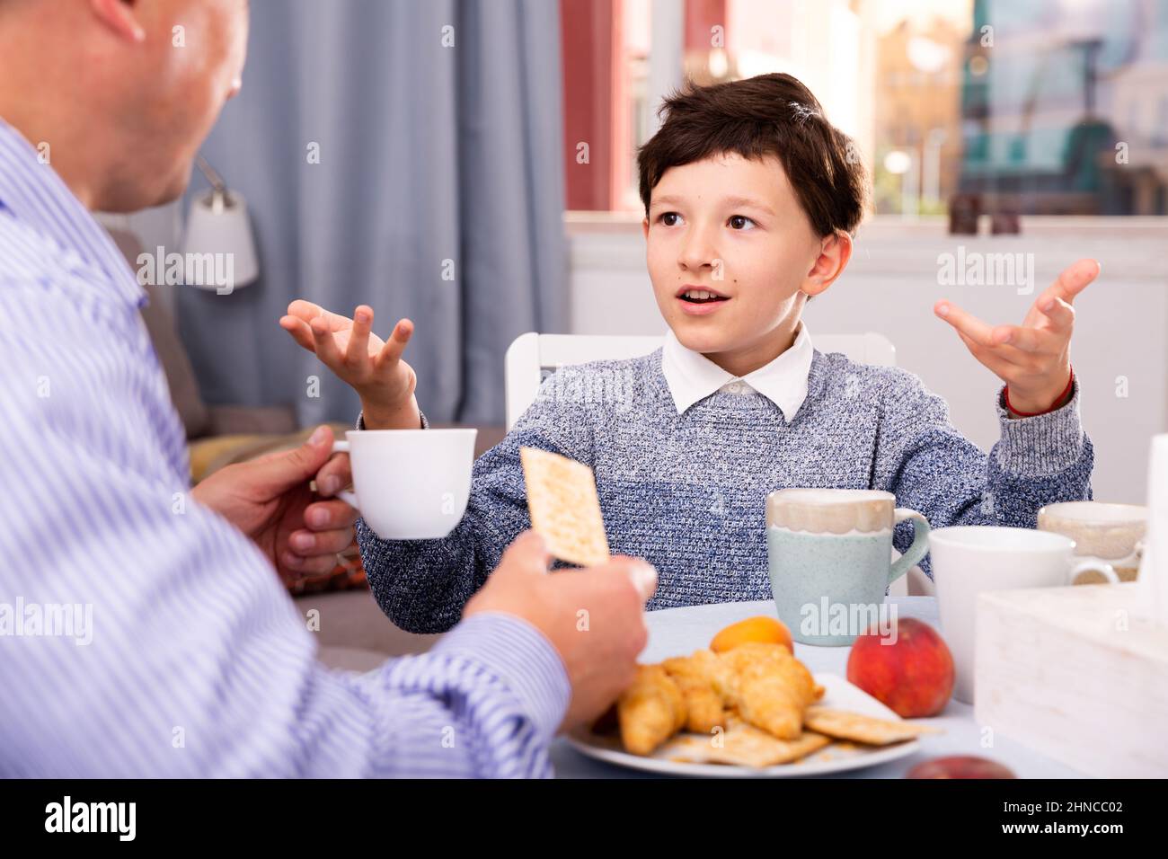 Teen boy talking to man home hi-res stock photography and images - Alamy