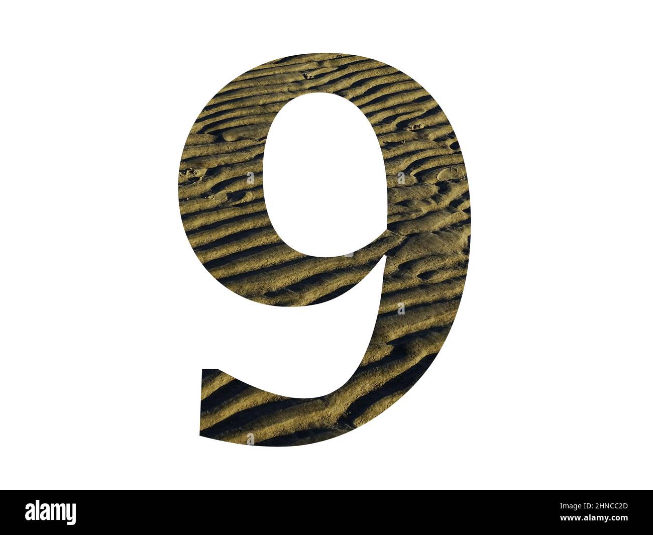 number 9 of the alphabet made with ridges from the beach, color yellow ...