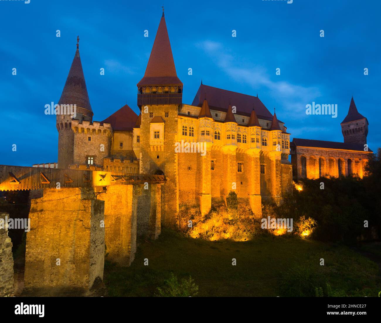 Corvin Castle is on the green mountain in night Stock Photo - Alamy