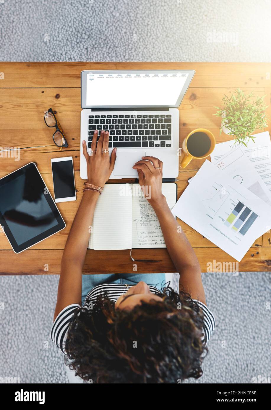 Getting things done more efficiently. Shot of an unrecognizable woman ...