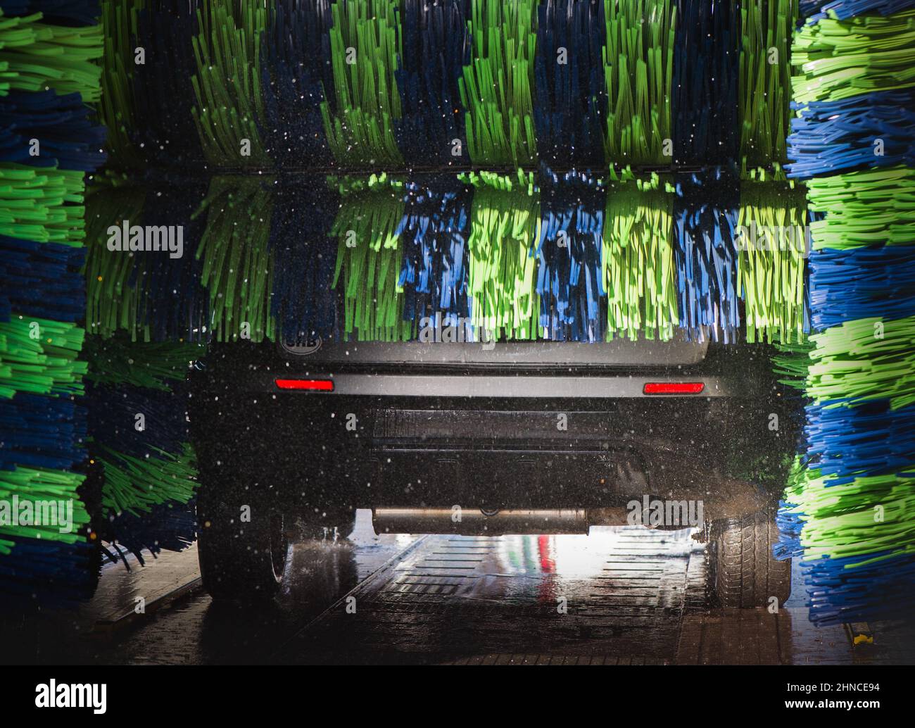 Grey car during washing process Stock Photo - Alamy