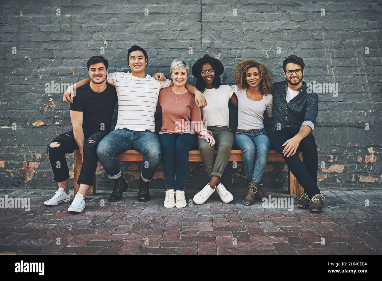 We there for each other. Shot of a diverse group of people chilling ...