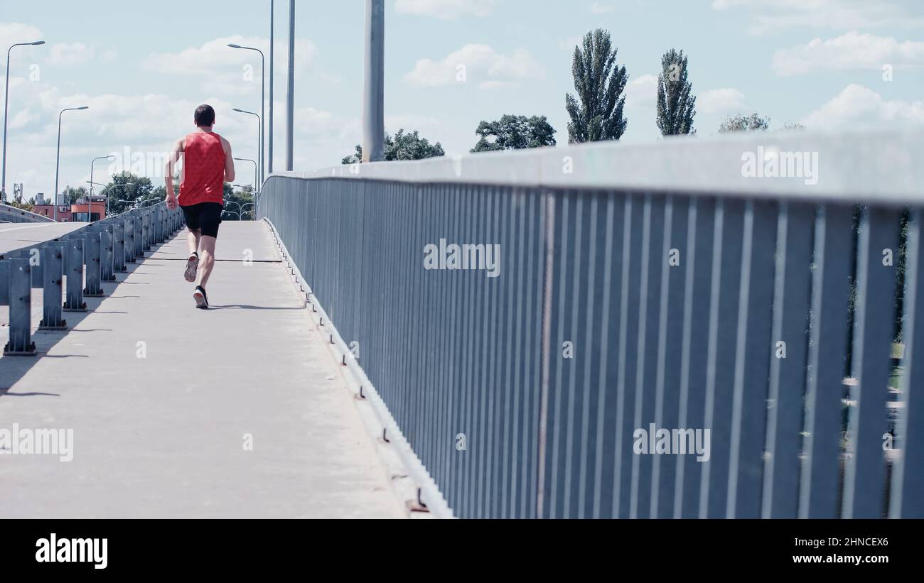 Back view young sportsman running hi-res stock photography and images ...